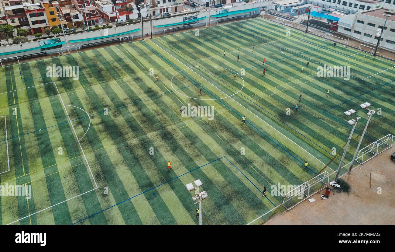 Aerial view of the football field in the middle of a messy neighborhood ...