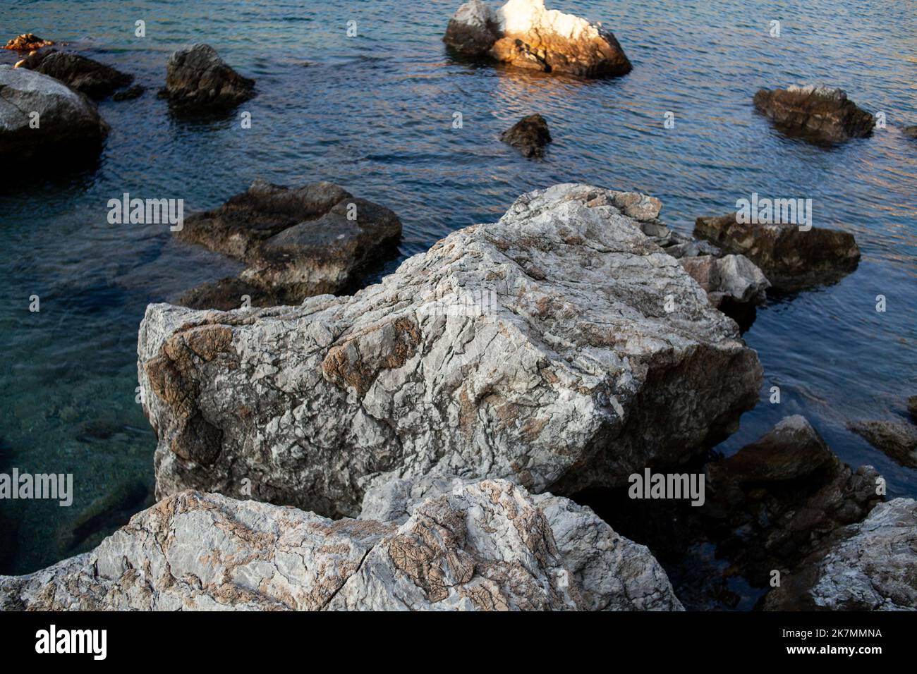 Rocks and stones in the sea. Sea stones. Rough stone surface texture ...