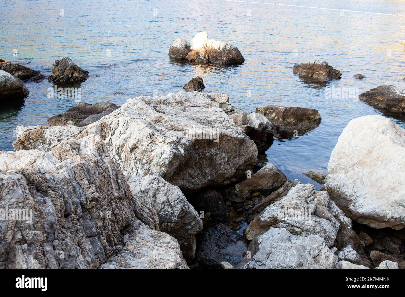 Rocks and stones in the sea. Sea stones. Rough stone surface texture ...