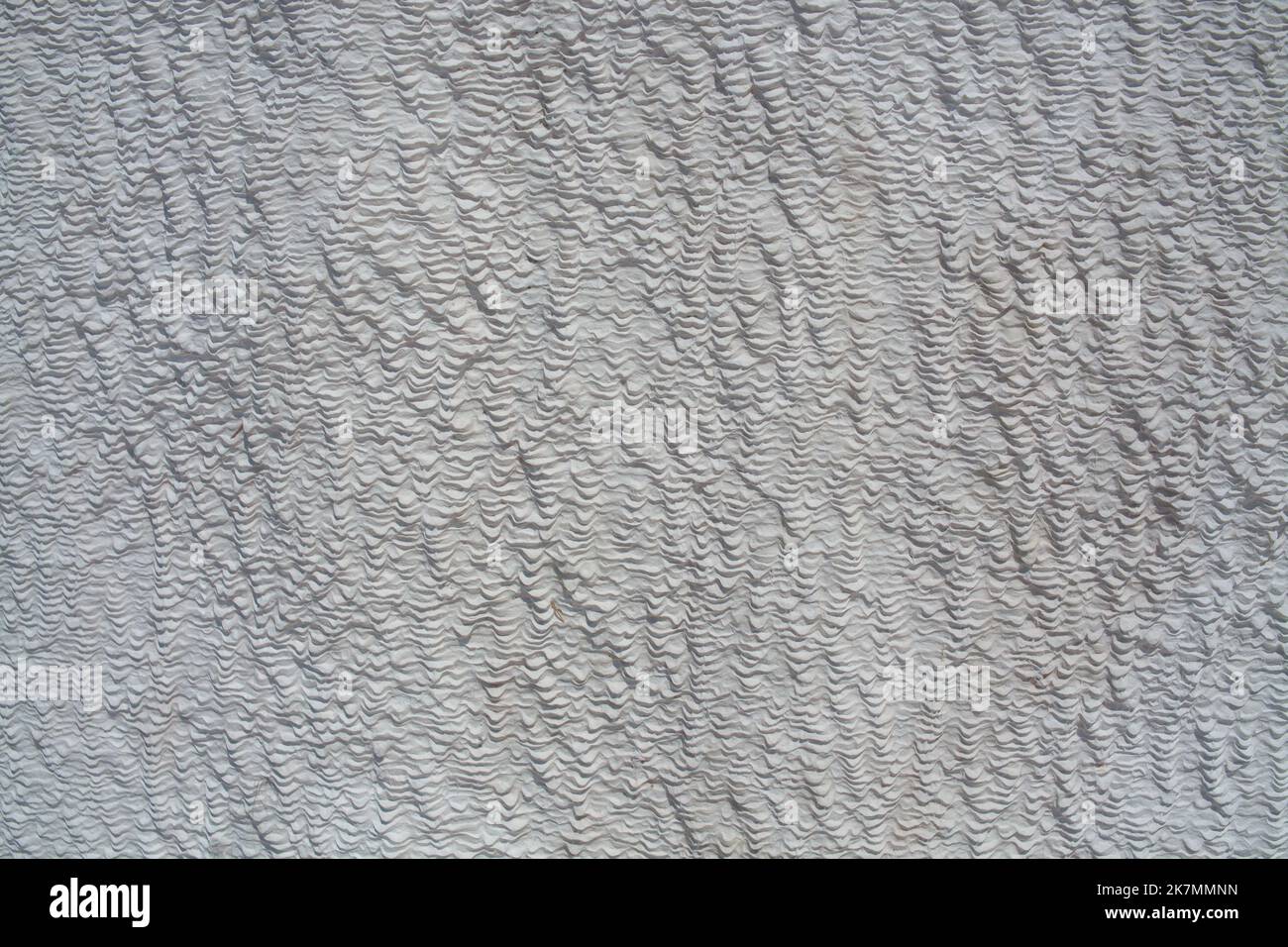 Background of natural white wall Pamukkale calcium travertine in Turkey ...