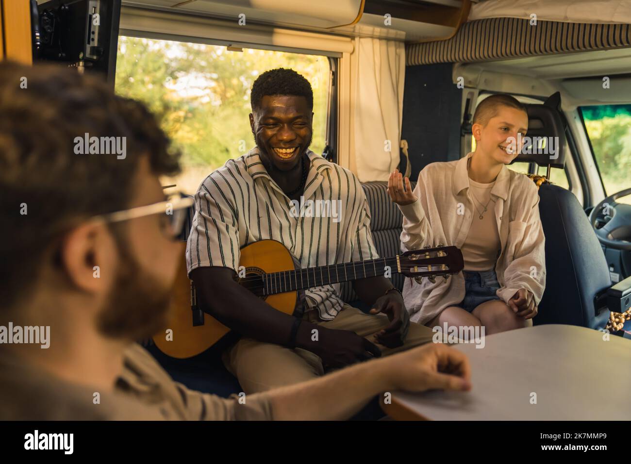 Van party and van travelers. Multiracial group of European friends ...