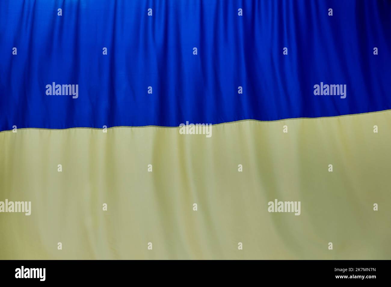 Waving national flag of Ukraine, UA is curved flag made of blue and ...