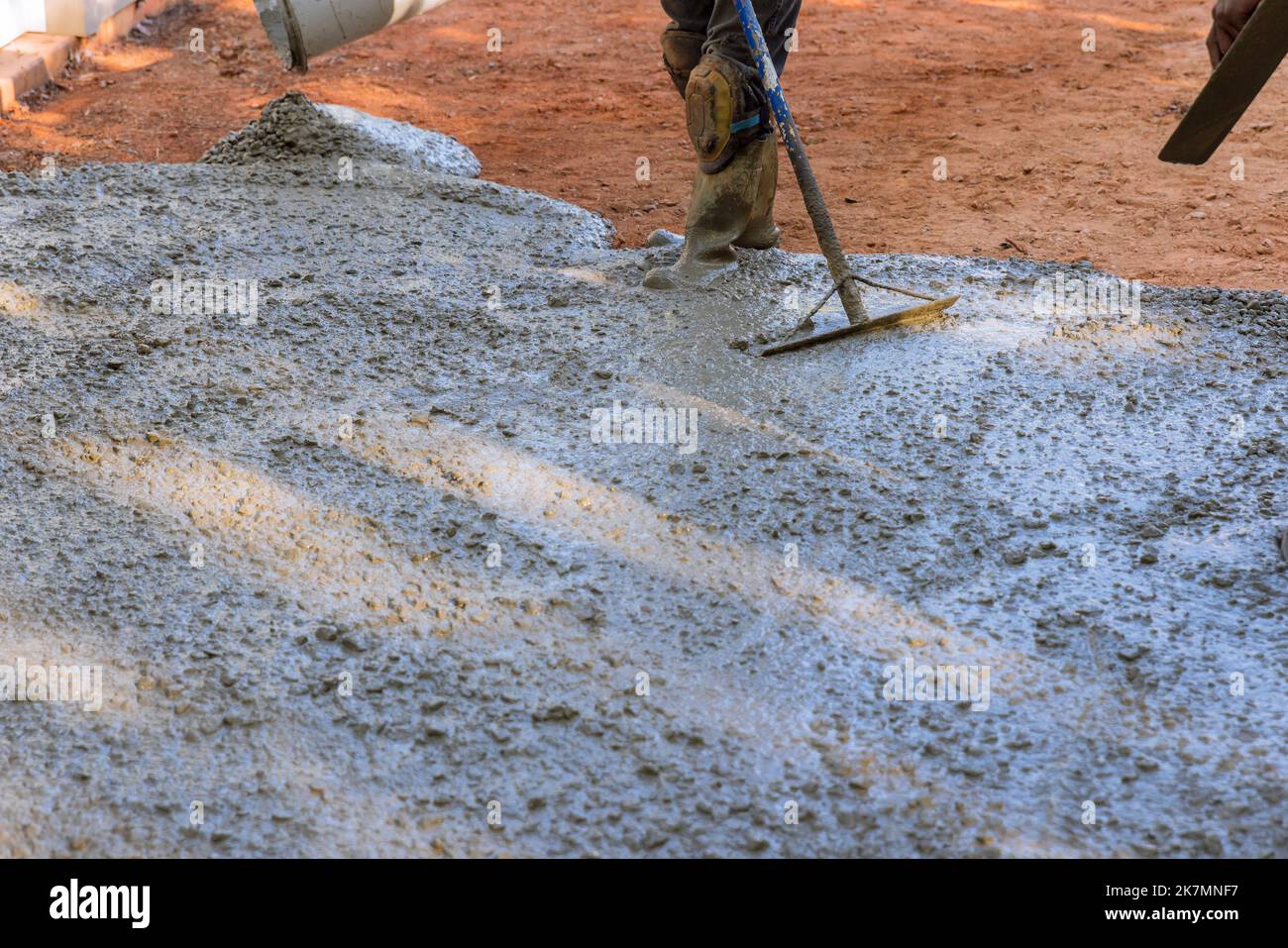 Driveway at near new home on construction site, we were poured wet concrete as hard as paving ...