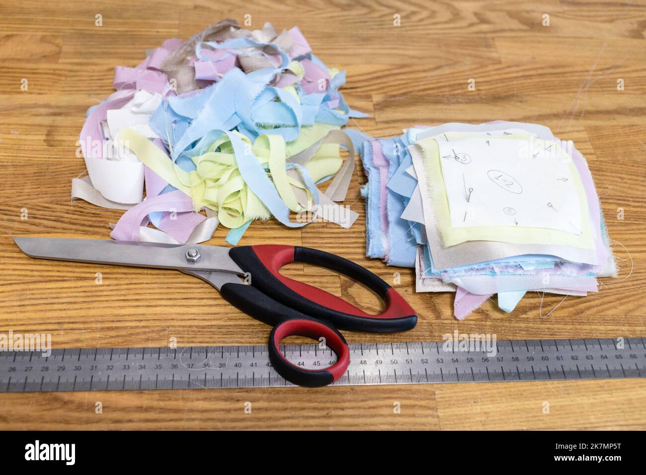 blanks of silk fabrics with fixed paper patterns prepared for patchwork ...