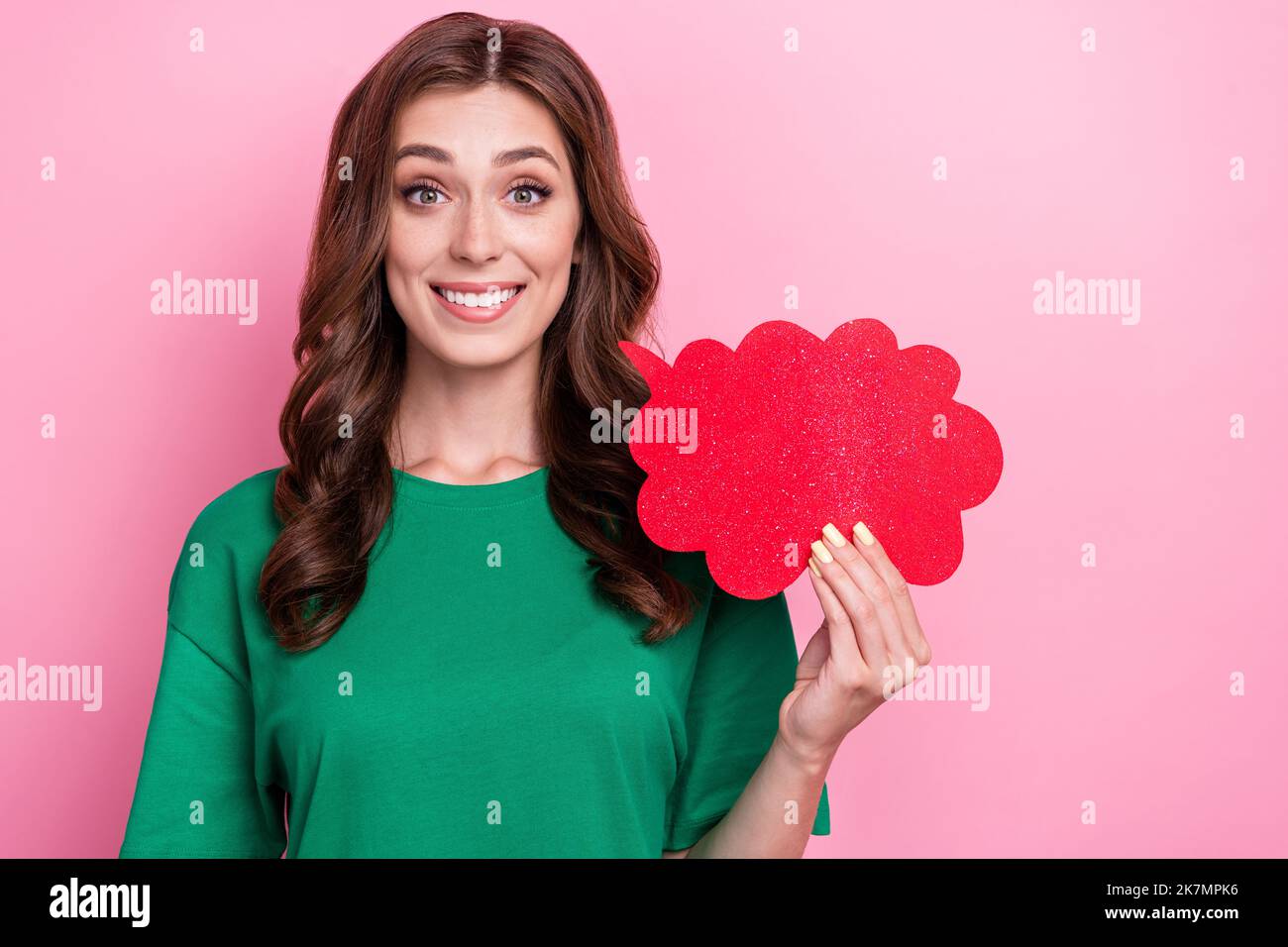Photo of pretty positive girl wear green trendy outfit arm hold empty ...