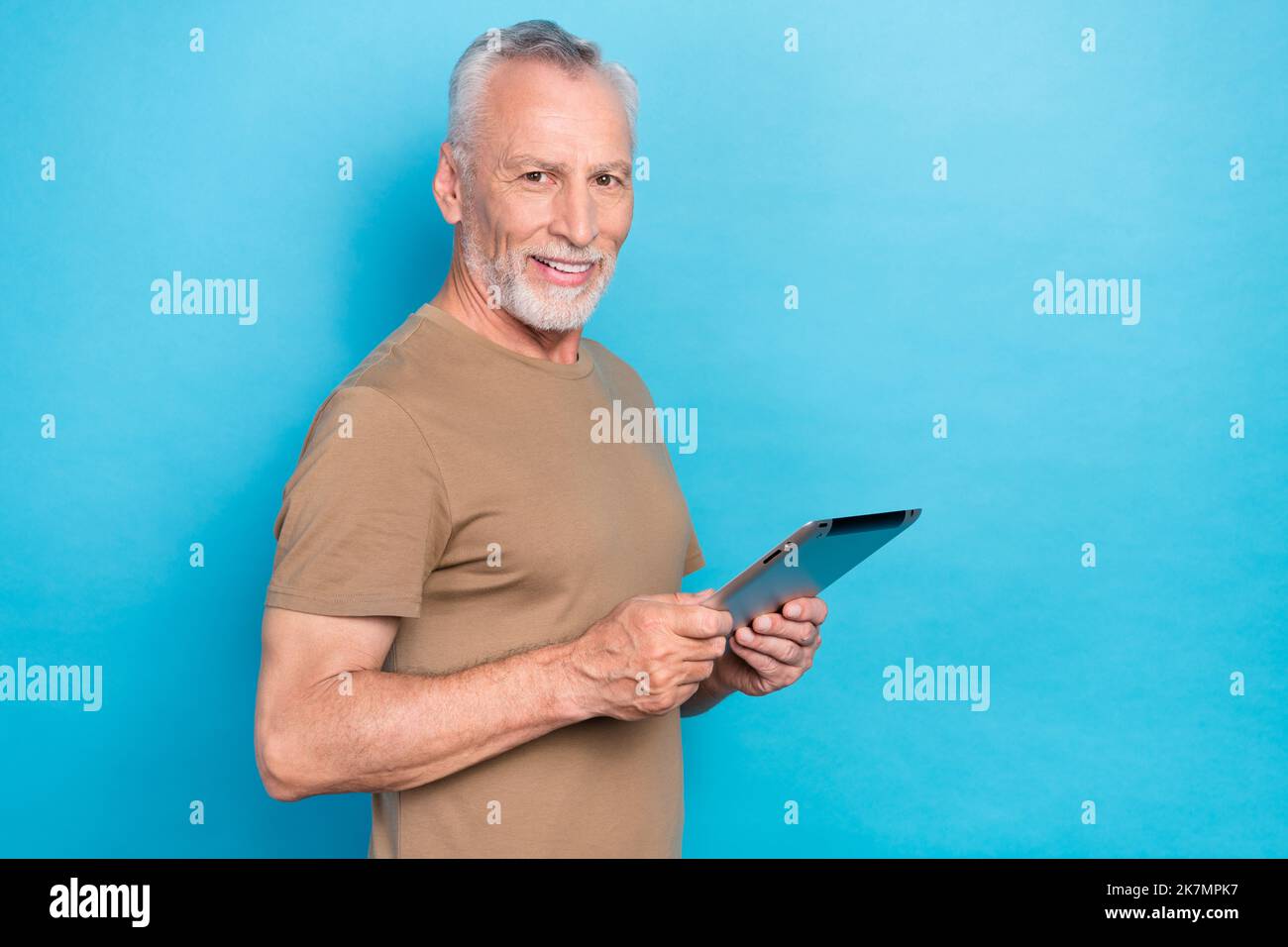 Portrait of cheerful optimistic retired man with gray hair beard ...