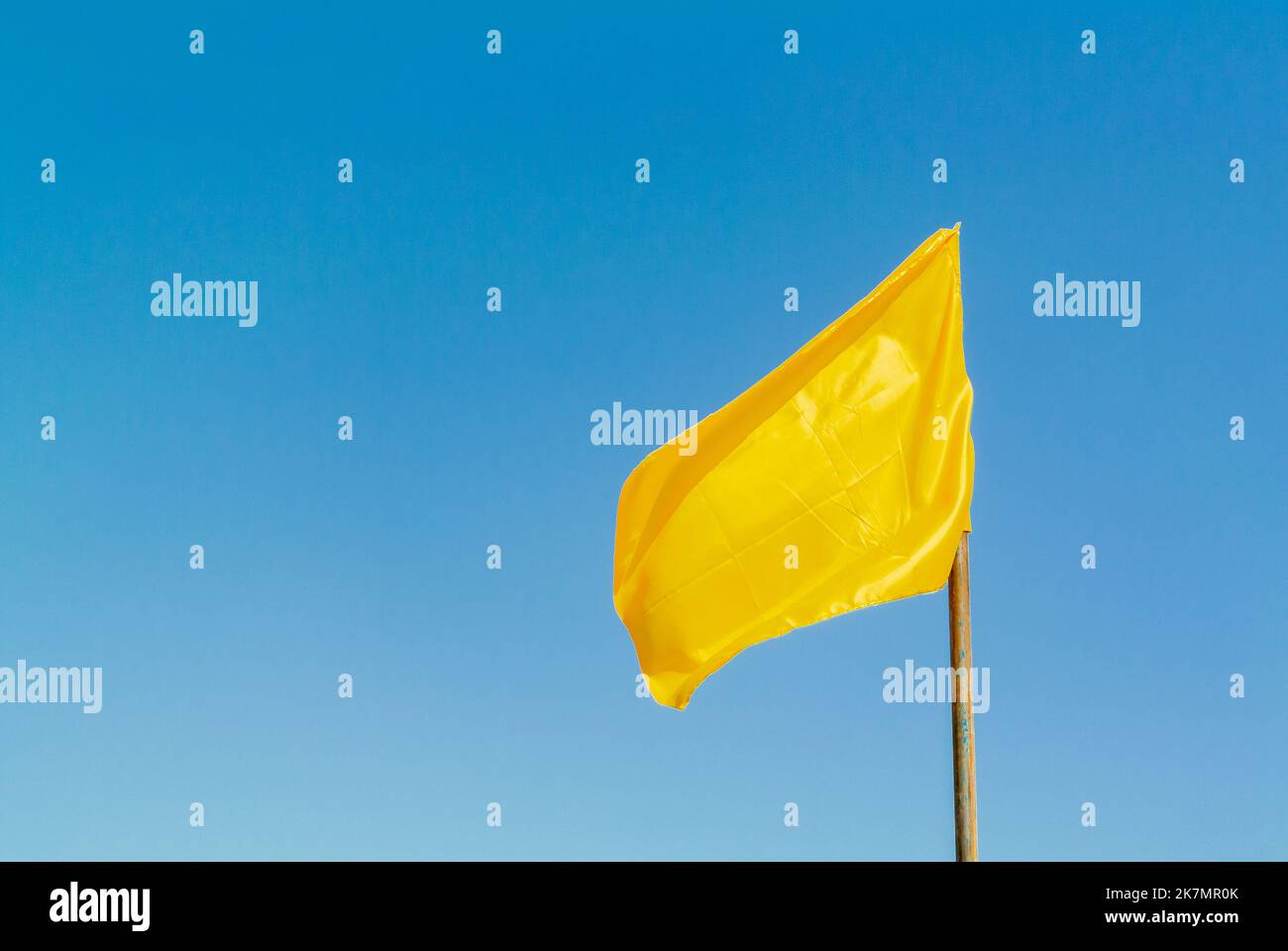 Yellow flag in the blue sky, mahabalipuram, tamil nadu/ India Stock ...