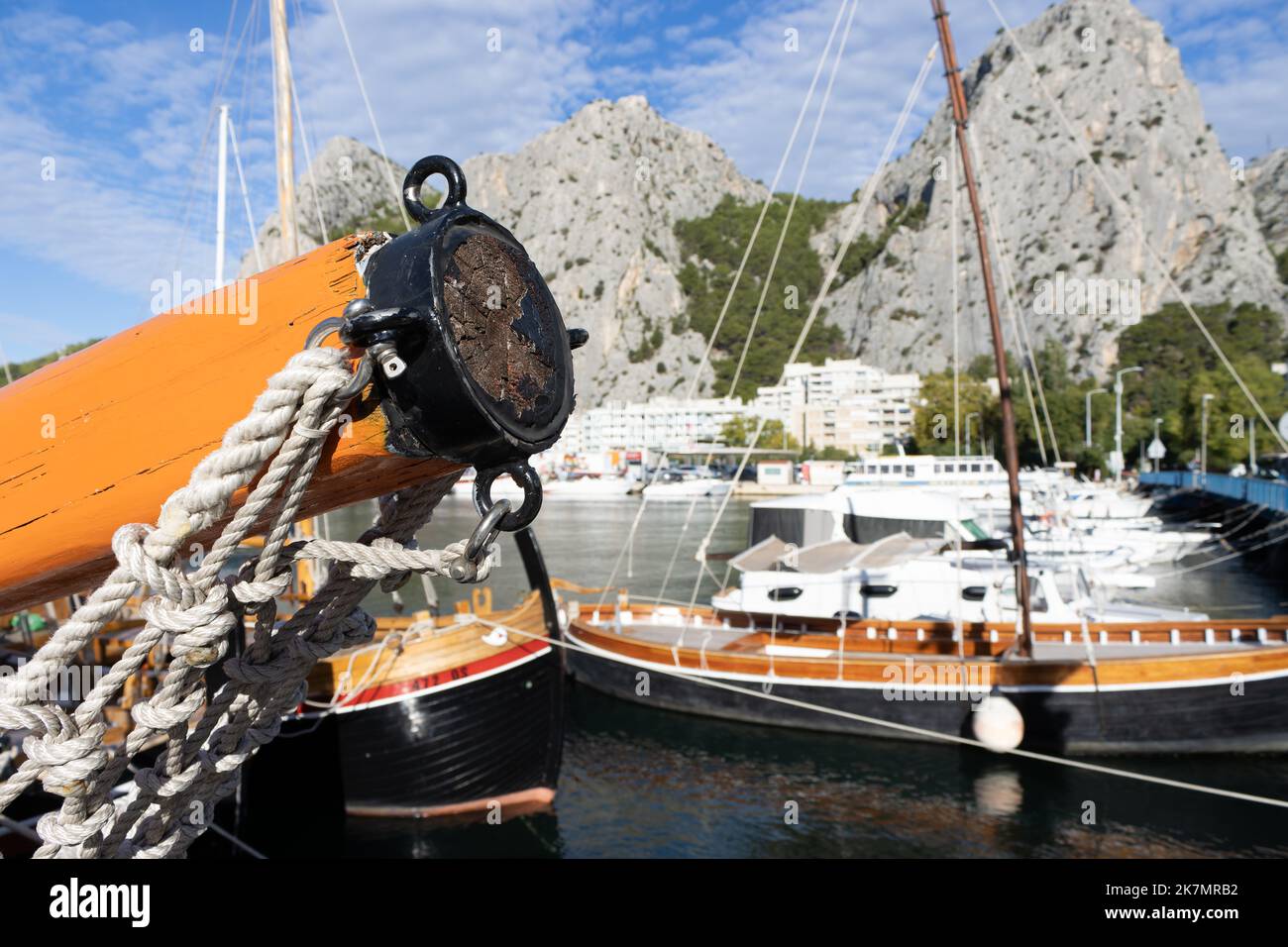 Boats anchored in the Omis harbor in Dalmatia, Croatia. On the right ...