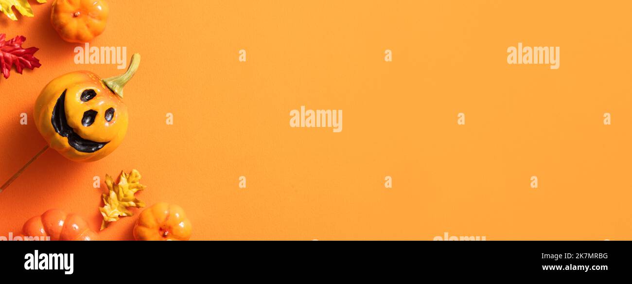 Creative Halloween design concept decoration on orange paper table ...