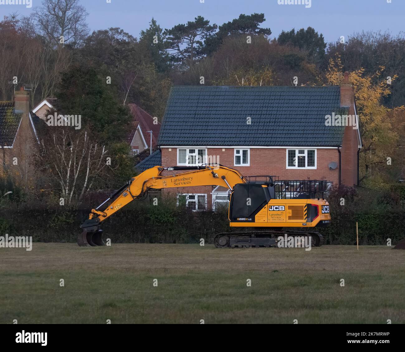 Tracked heavy vehicle, JCB 220X LC digger working on excavation to lay ...