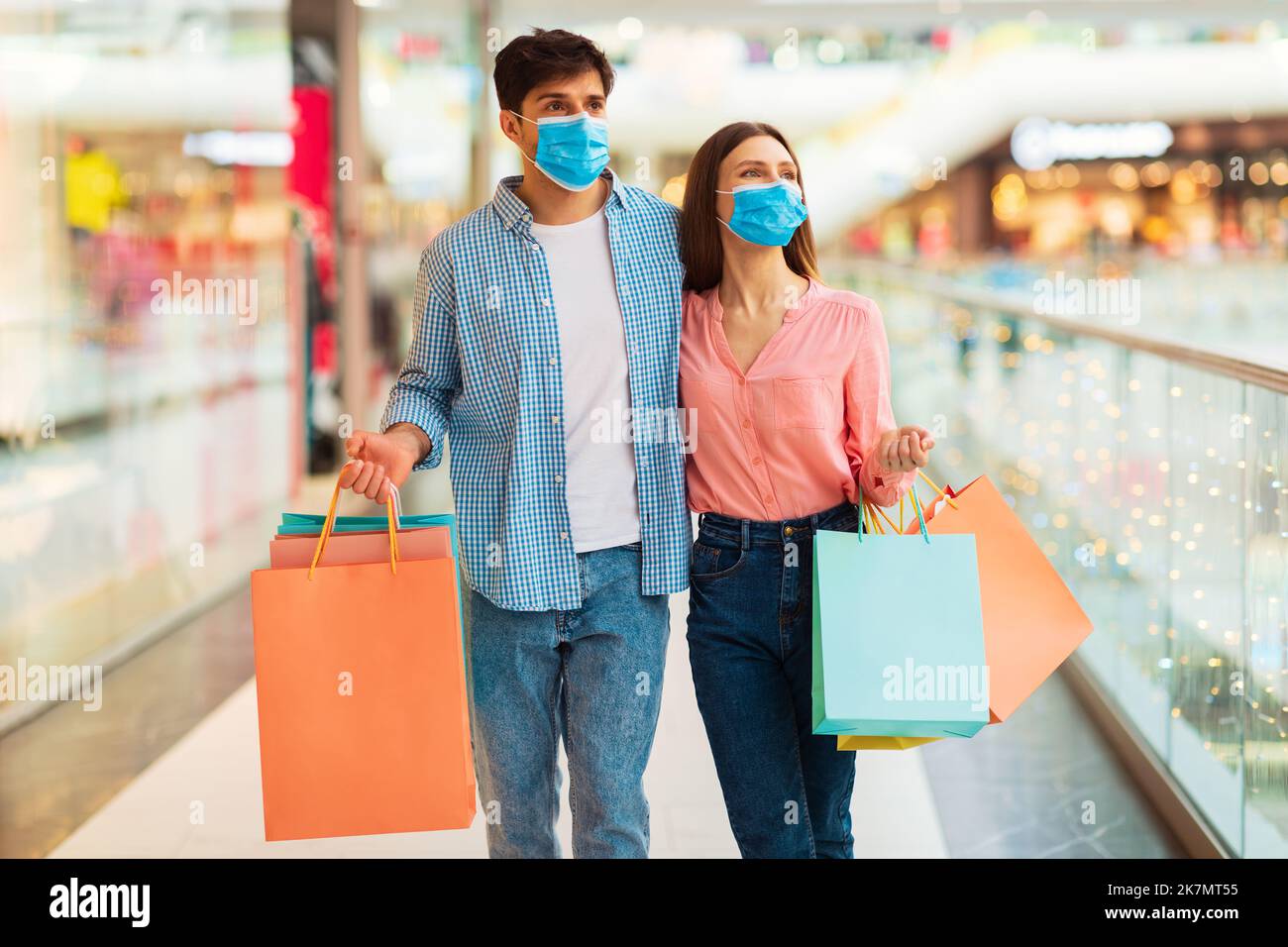 Buyers Couple Shopping Walking In Mall, Wearing Face Masks Stock Photo ...