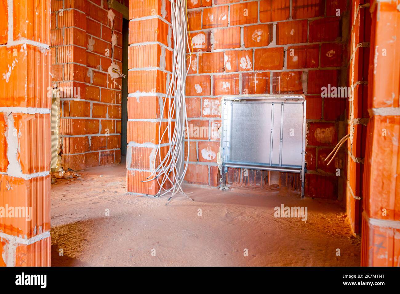 Bundle of various cables are hanging from ceiling, new empty ...