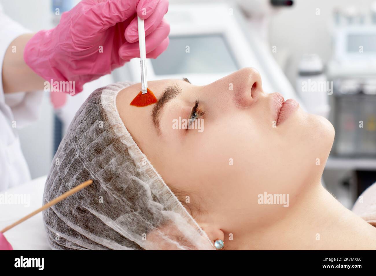 procedure of photoepilation in the beauty salon. Young Woman Receiving ...