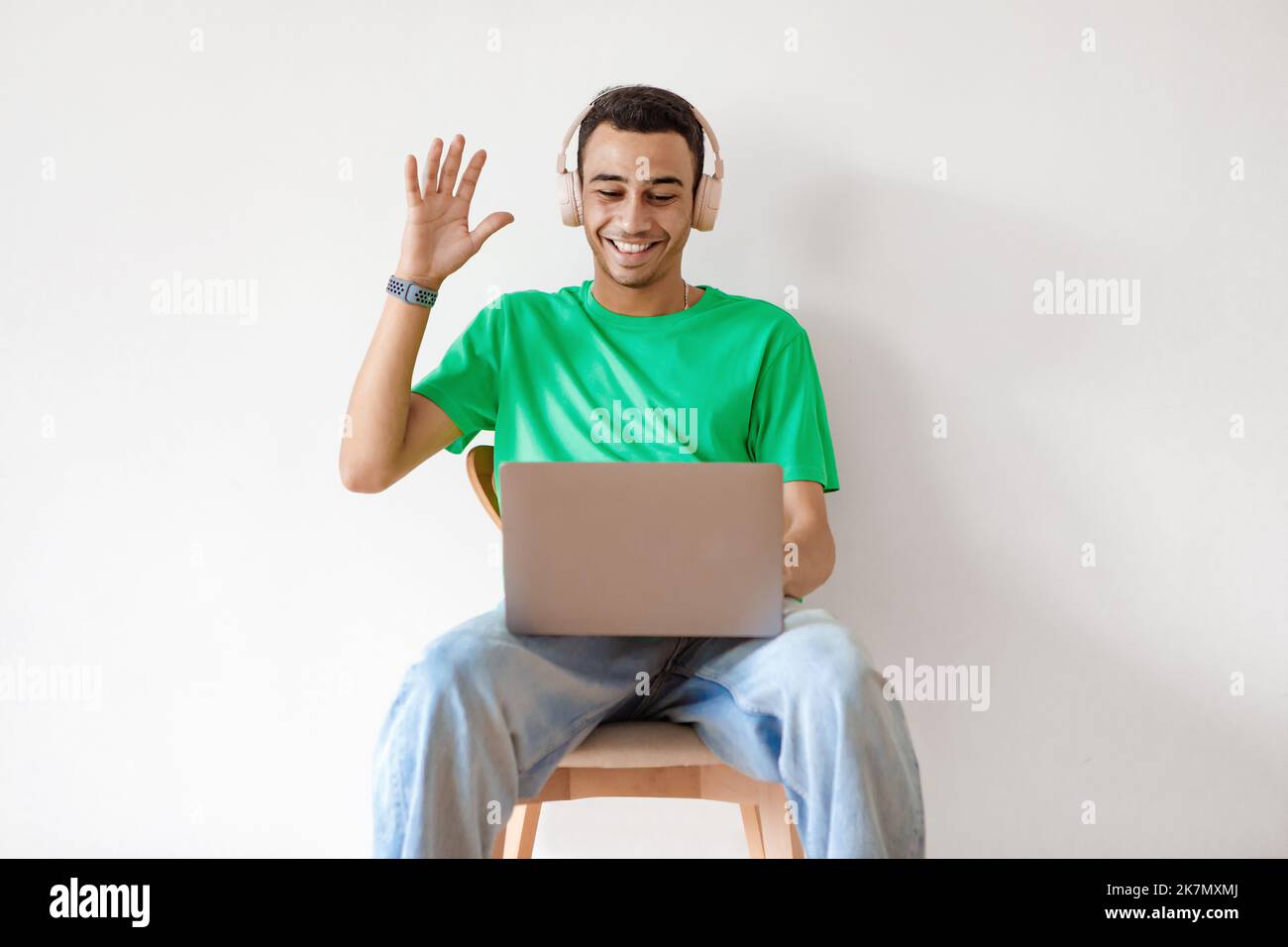 Excited handsome guy waving hi-res stock photography and images - Alamy