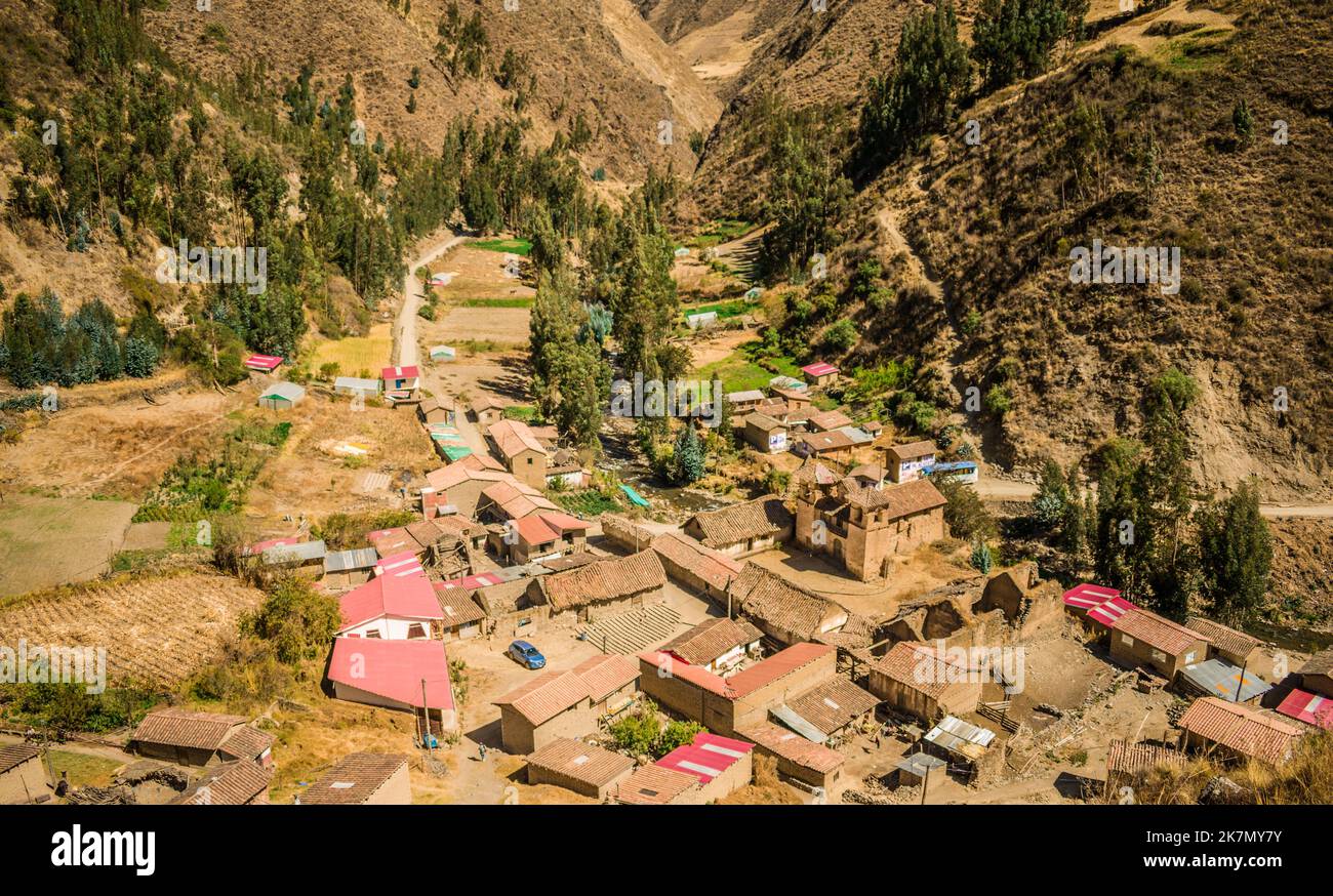 An aerial of a townscape with yellow, forested hills around Stock Photo ...