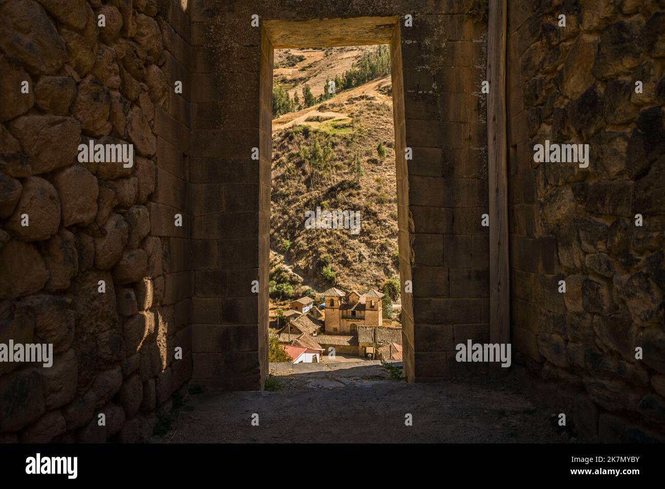 A closeup of a window looking to the townscape with brick walls, an ...