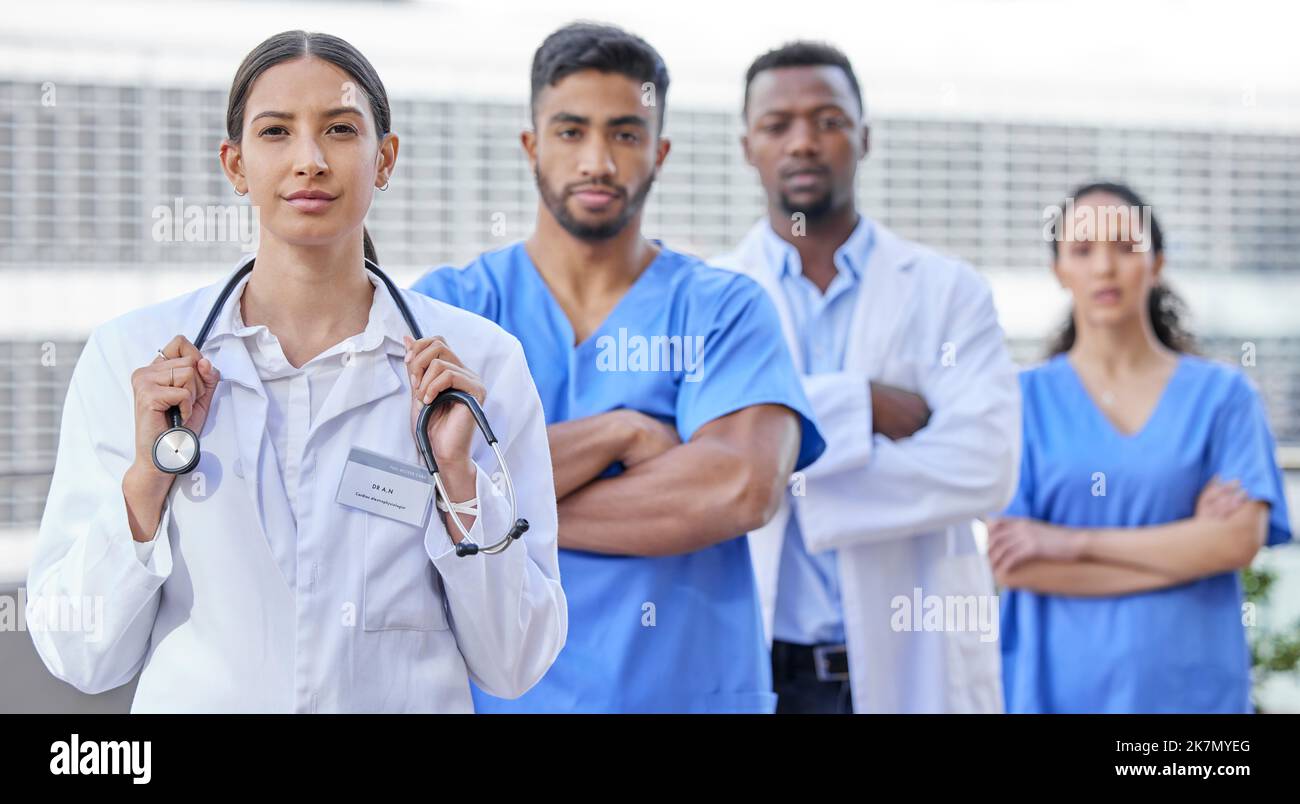 Were ready for anything. a group of doctors standing against a city ...