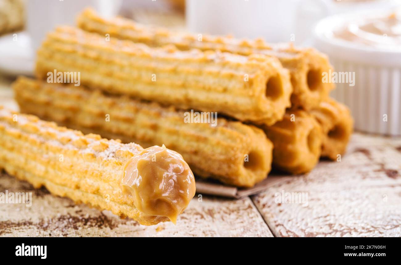 Churros, typical sweet from Brazil and America, fried and stuffed with ...