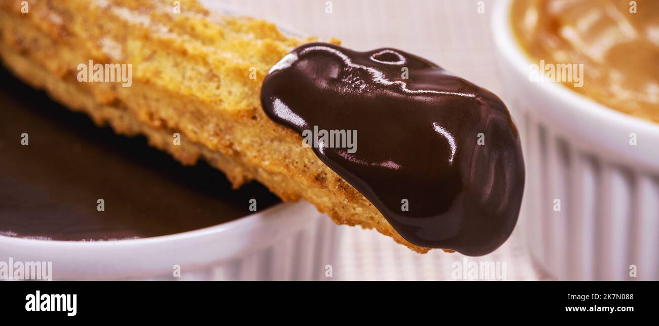 Churros, a typical sweet from Brazil and America, fried and stuffed ...