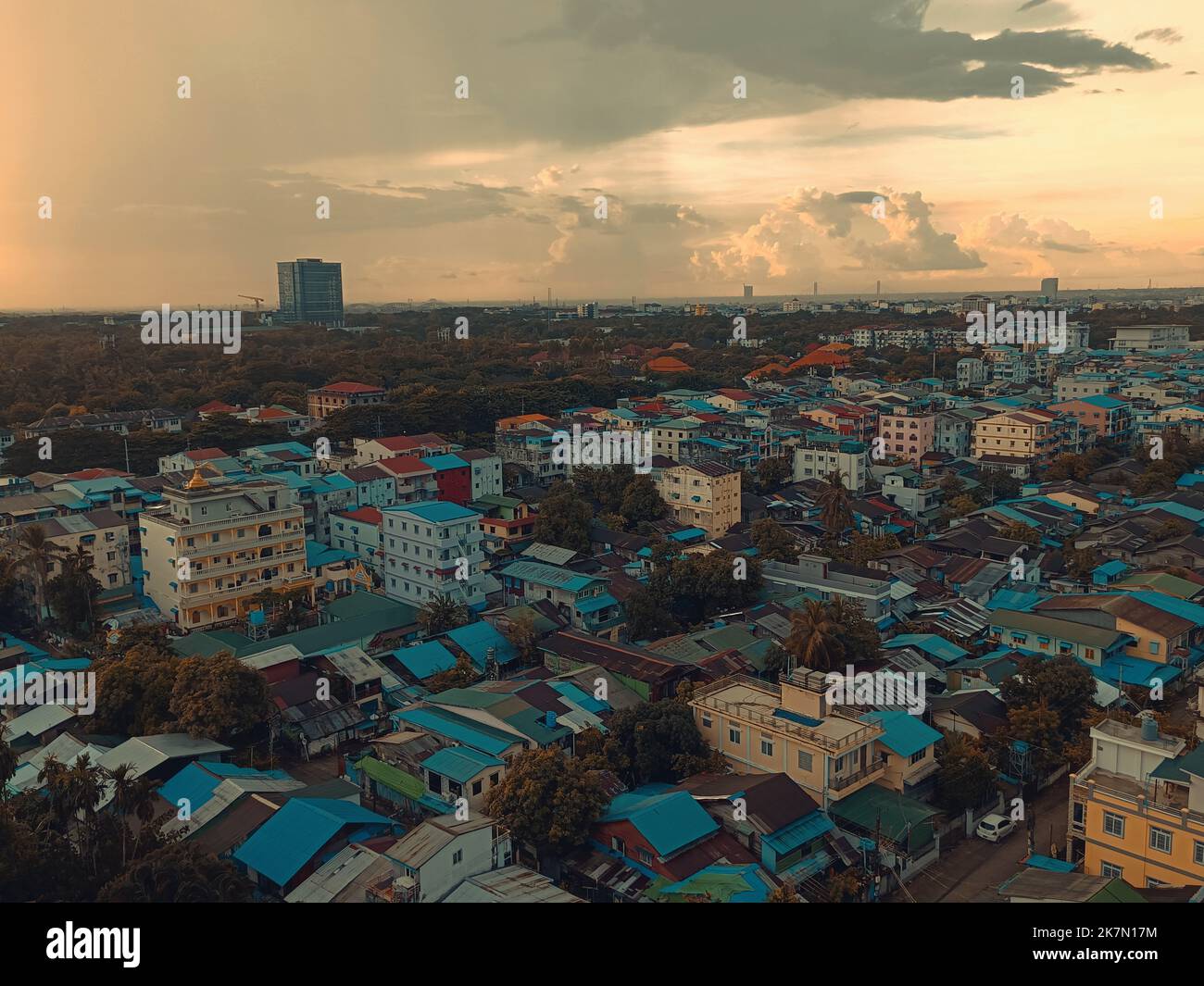 The buildings with colorful roofs of Mandalay, Myanmar drowning to the ...