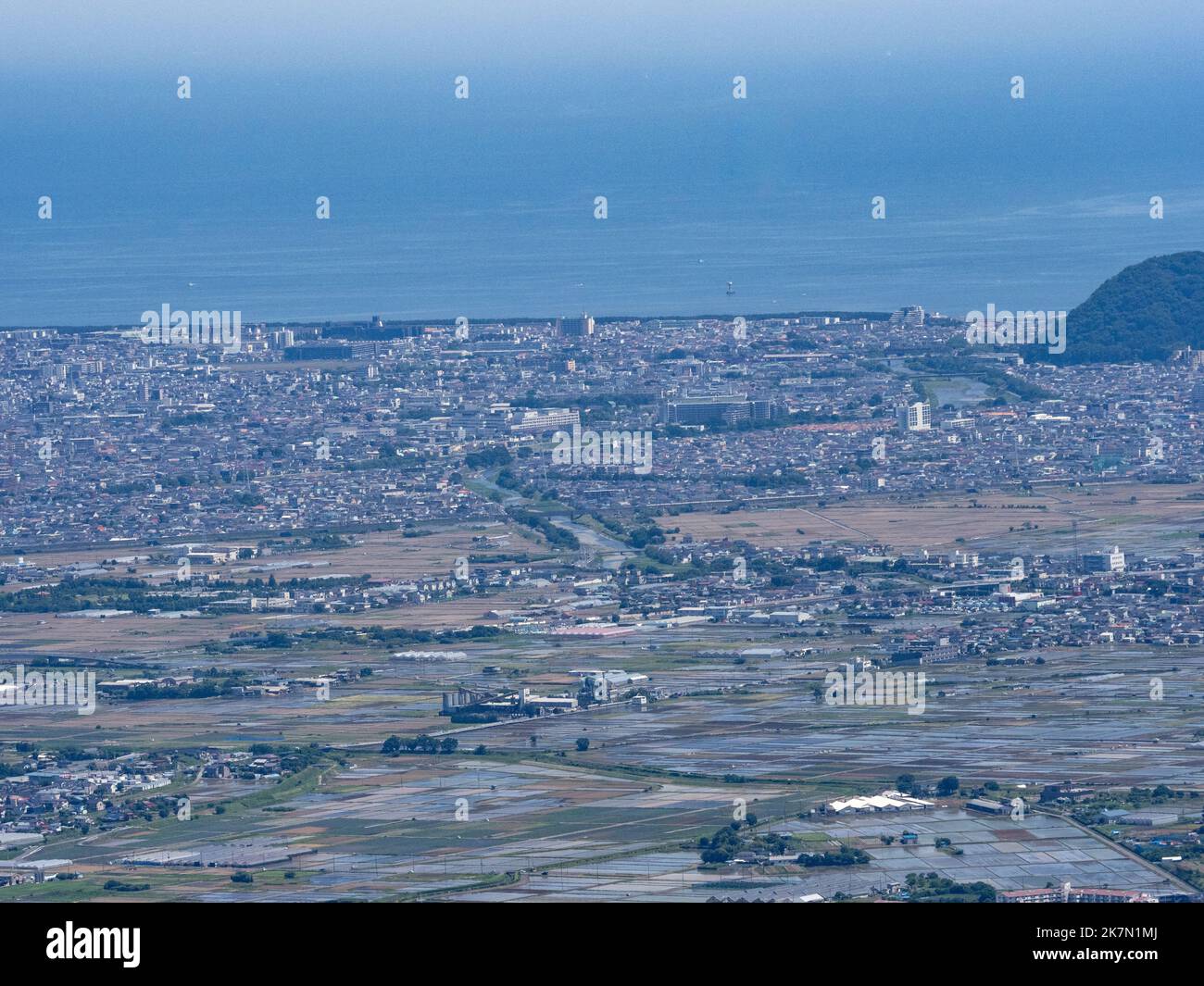 An aerial shot of Chigasaki, Hiratsuka, and Sagami Bay from the side of ...