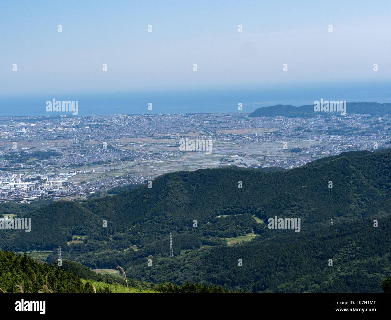 An aerial shot of Chigasaki, Hiratsuka, and Sagami Bay from the side of ...