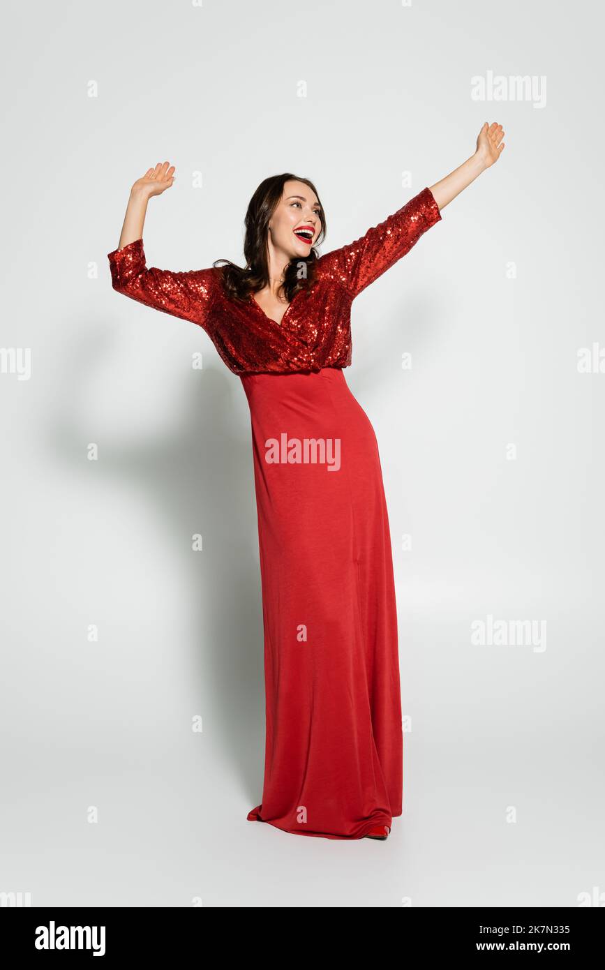 Young brunette in red dancing hi-res stock photography and images - Alamy