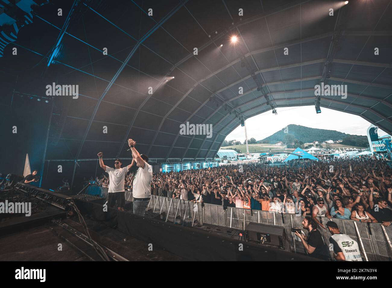 A behind stage high-angle of male singers performing on the stage ...