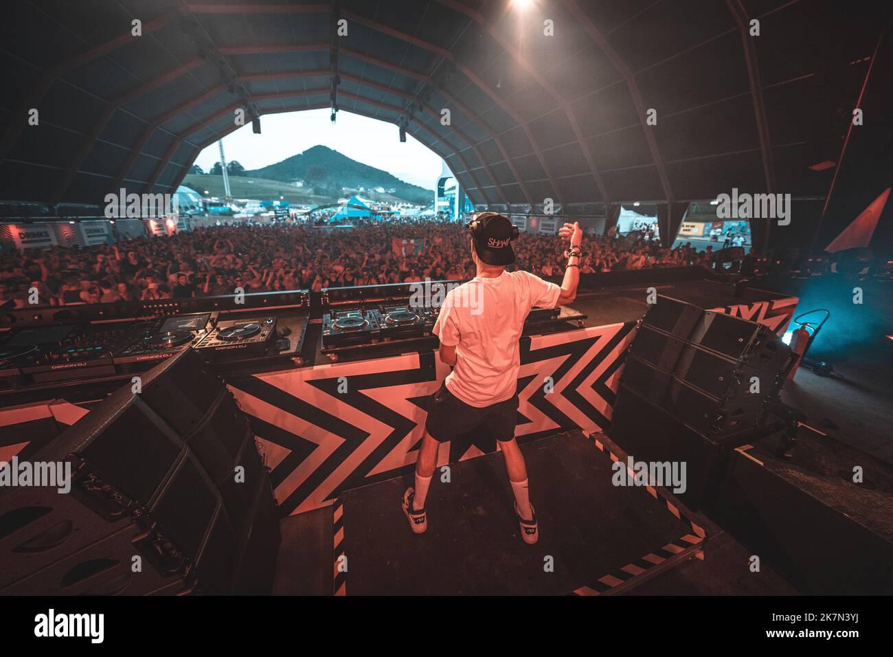 A behind stage high-angle of rear male singer performing on the stage ...