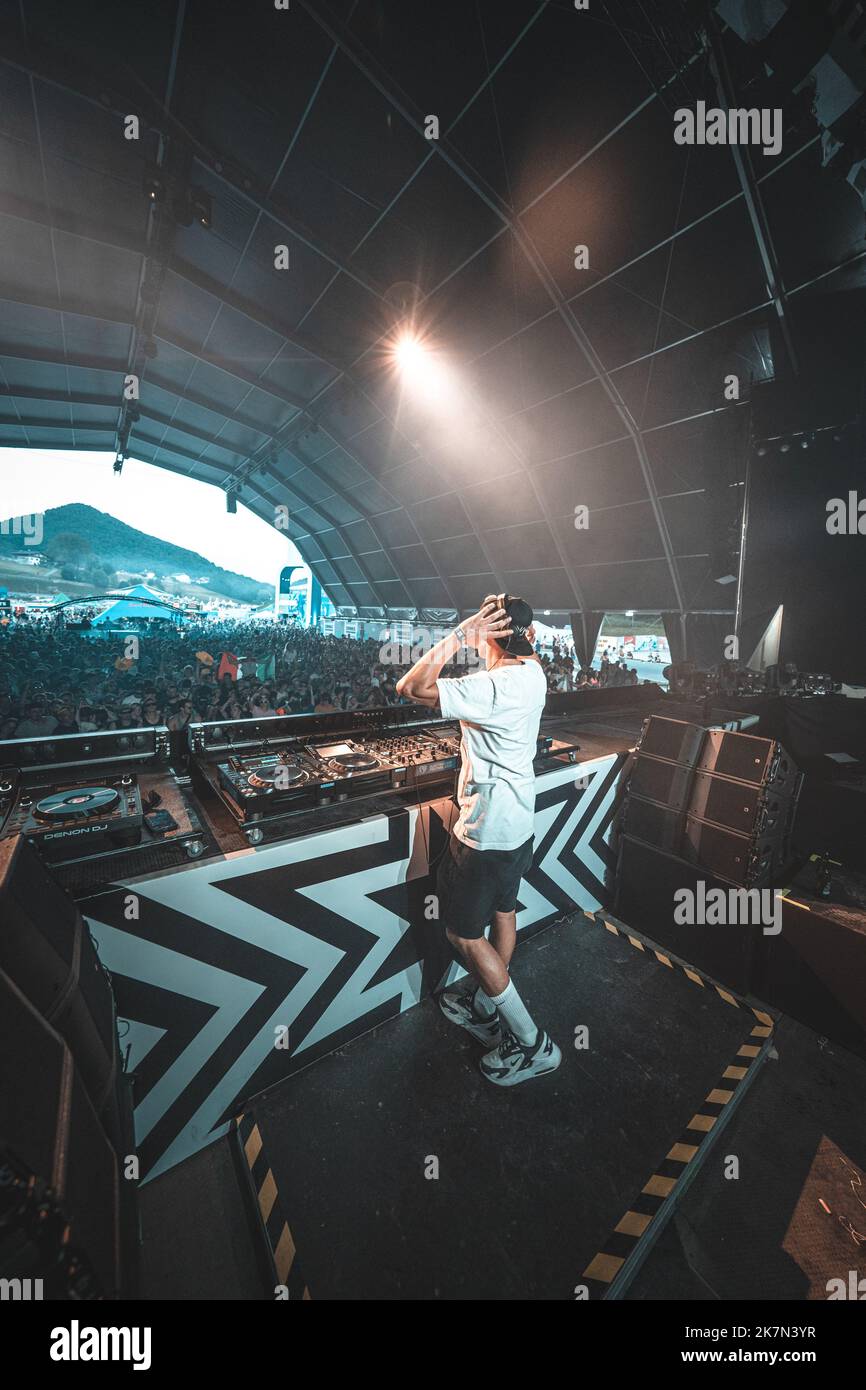 A behind stage high-angle of rear male singer performing on the stage ...