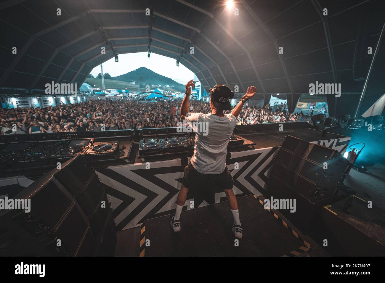 A behind stage high-angle of rear male singer performing on the stage ...