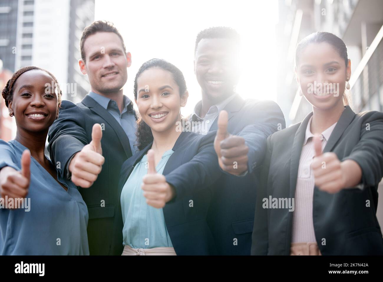 Youre in good hands with us. a group of young businesspeople showing a ...