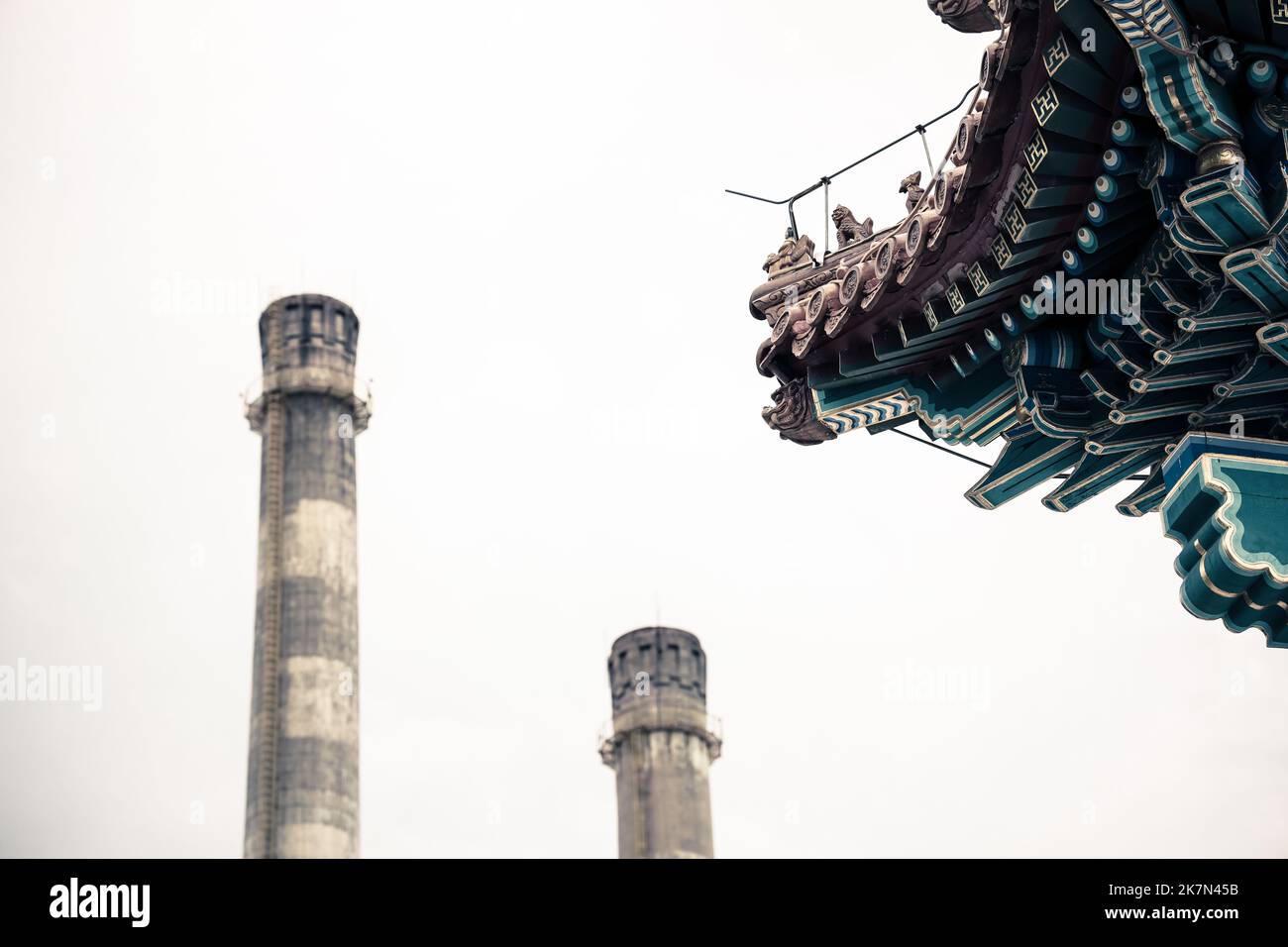 A partial view of an outdoor traditional Chinese ceiling and two ...