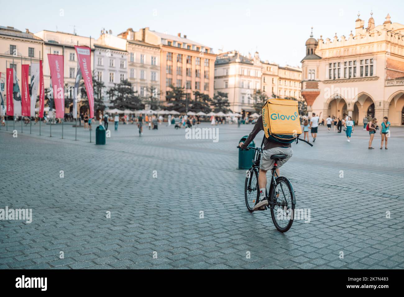 Krakow, Poland - 25 August 2022: An unidentified Glovo bike courier on ...