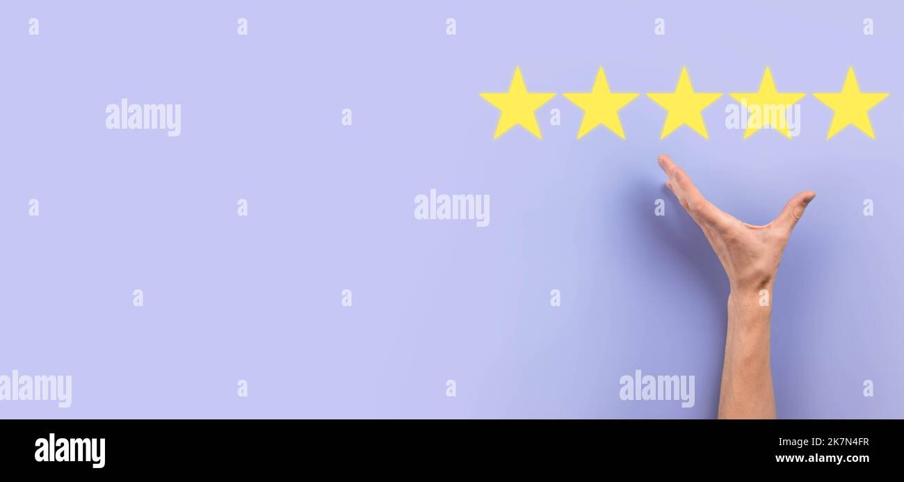 Man holds smart phone in hands and gives positive rating, icon five ...