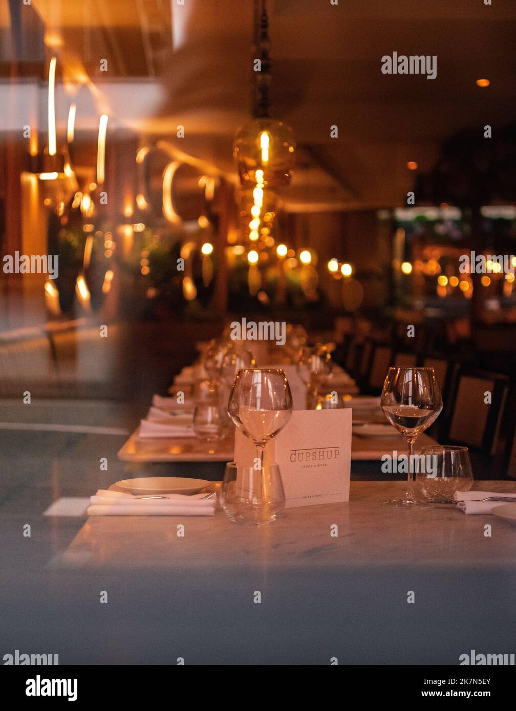 A vertical of a cozy interior of a posh restaurant in Hale Village ...