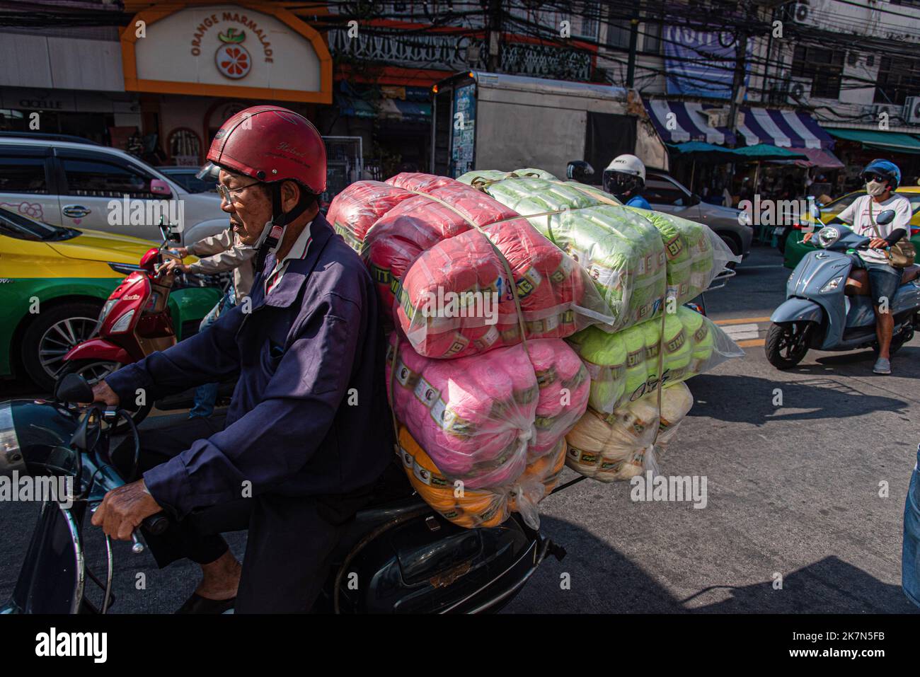 Bangkok, Thailand. 18th Oct, 2022. An extra loaded motorbike carrying ...