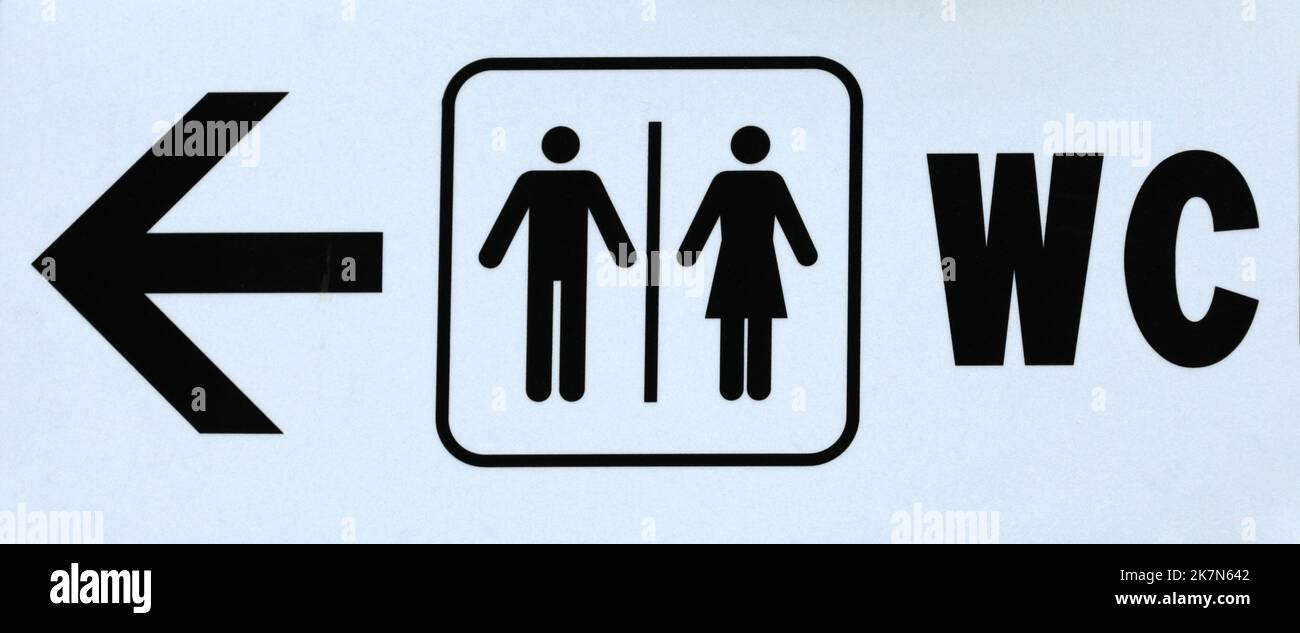 Restroom woman man unisex restroom sign Stock Photo - Alamy