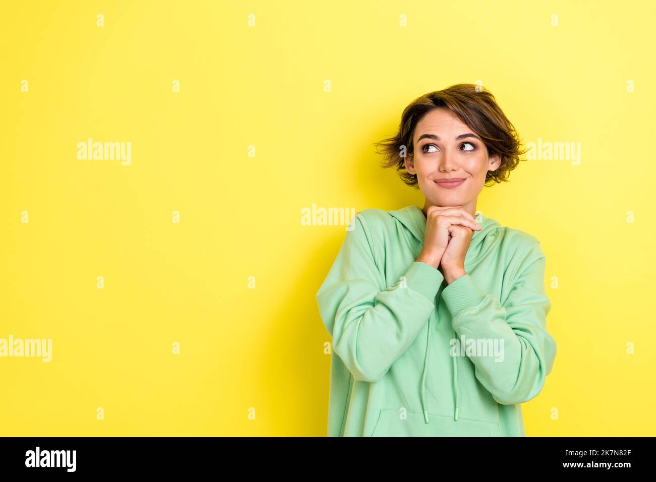 Photo portrait of nice young lady look admire empty space shy hands ...