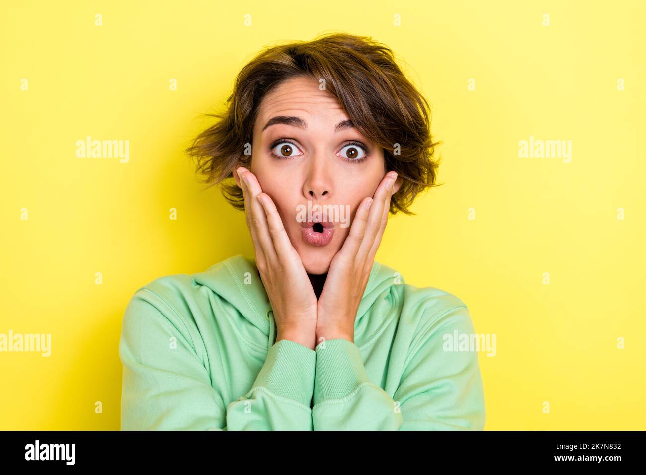 Photo portrait of charming young woman palms touch cheeks terrified bad ...
