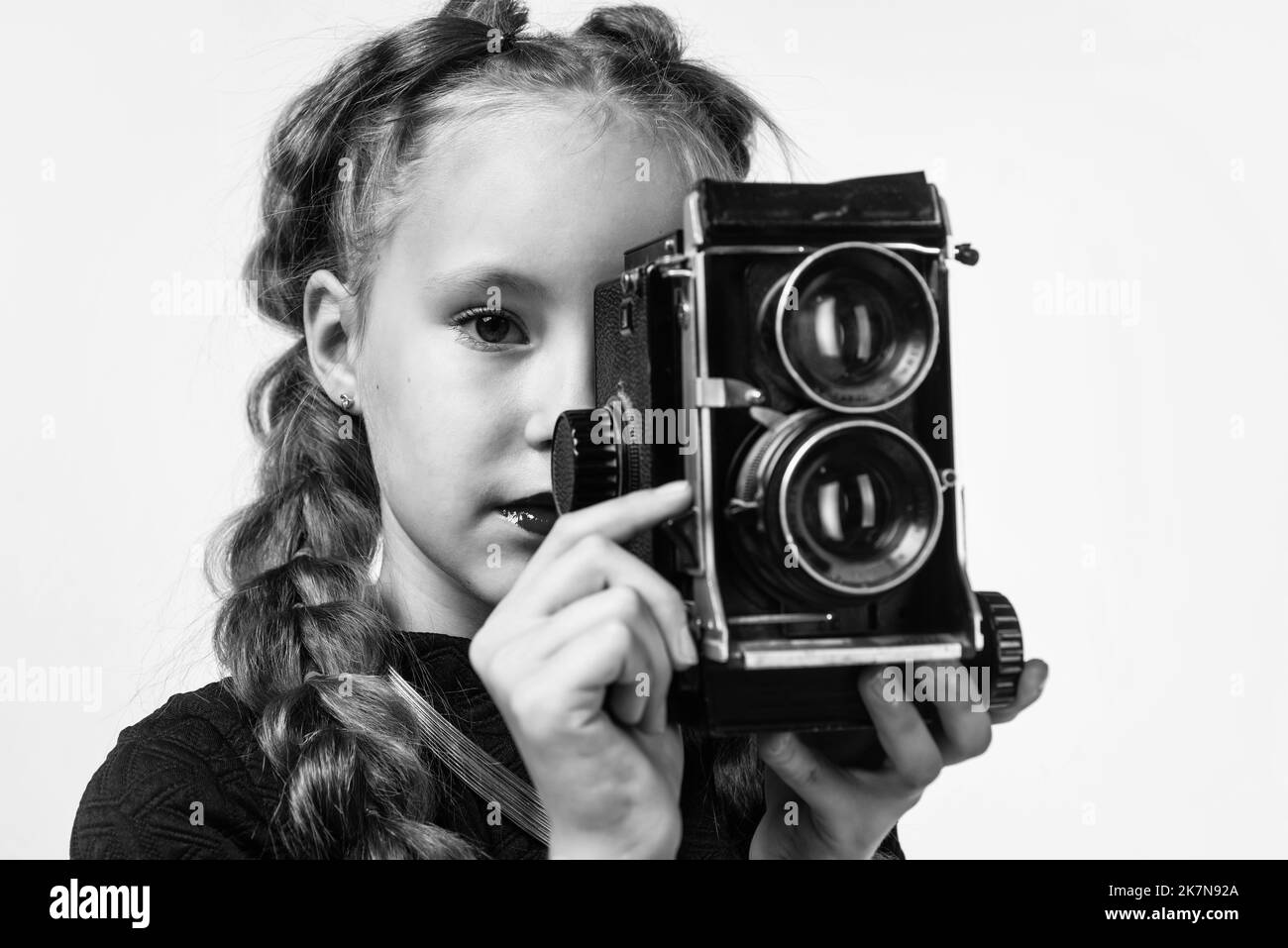 old fashioned tech. kid with vintage camera isolated on white Stock ...