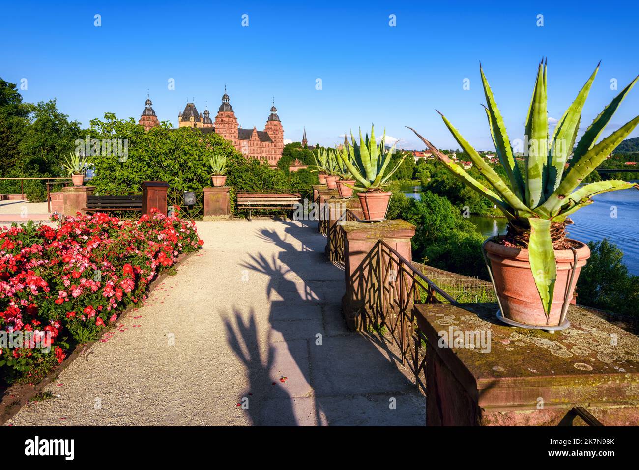 Public park on Main river with view to historical Schloss Johannisburg ...