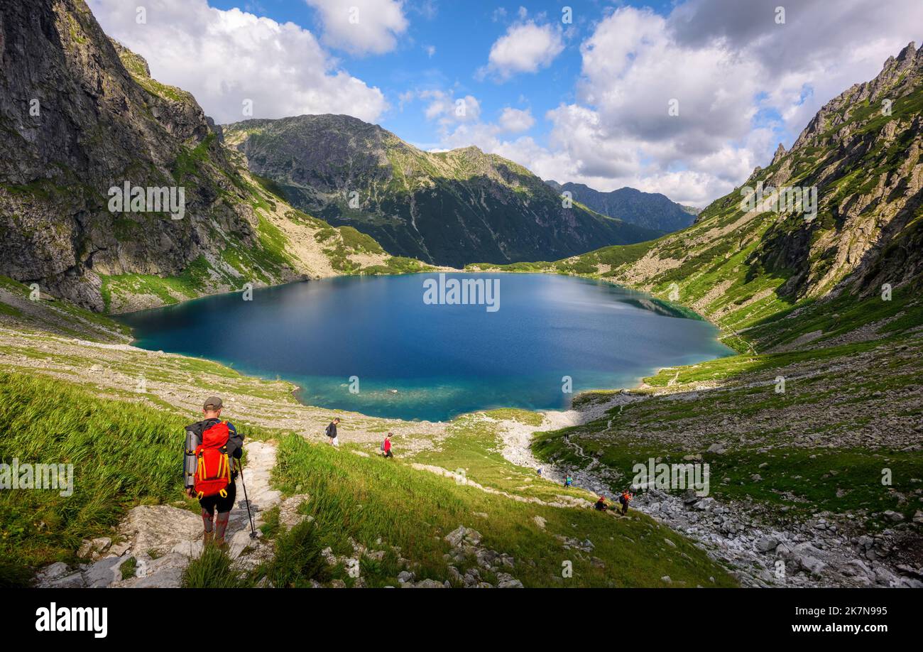 Hikers descending from Mount Rysy to Czarny Staw or Black Lake in Tatra ...