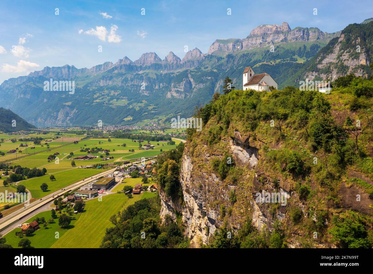 St Georges Chapel on a rock over a swiss alpine valley in Flums town ...