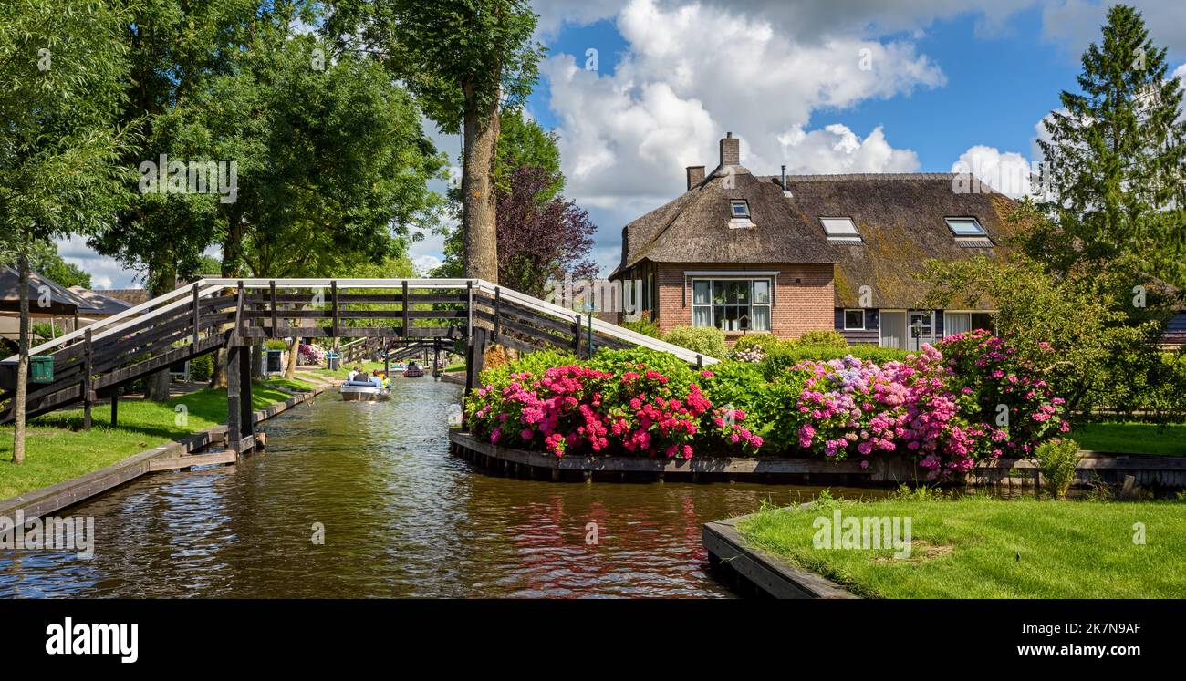 Panoramiv view of the water canal and traditional dutch brick houses in idyllic Giethoorn ...