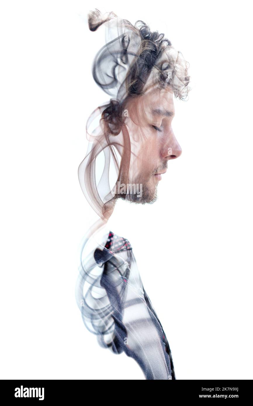 A flow of smoke forming a portrait of a young man Stock Photo - Alamy