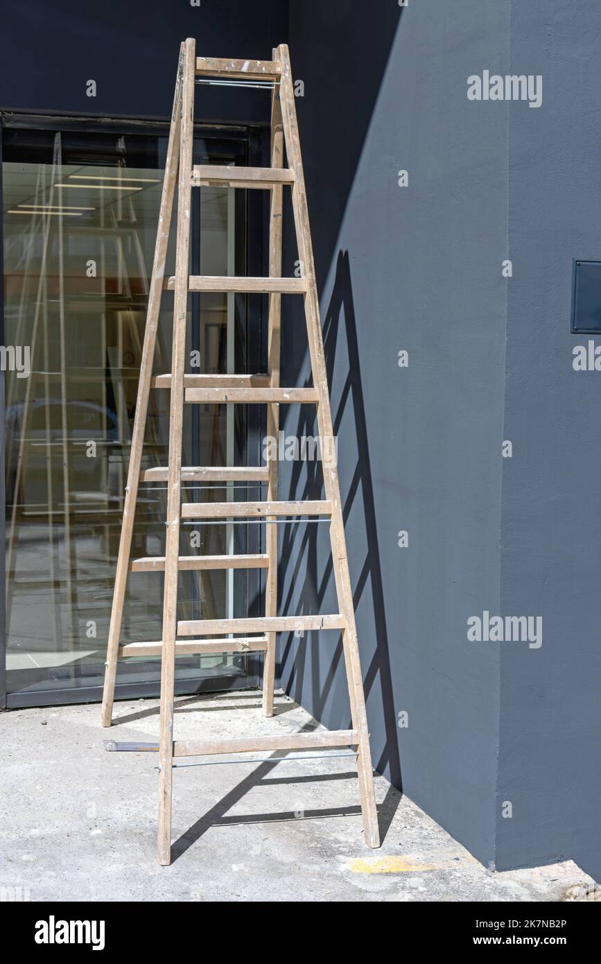 Tall Wooden Ladder at Building Exterior Works Stock Photo - Alamy