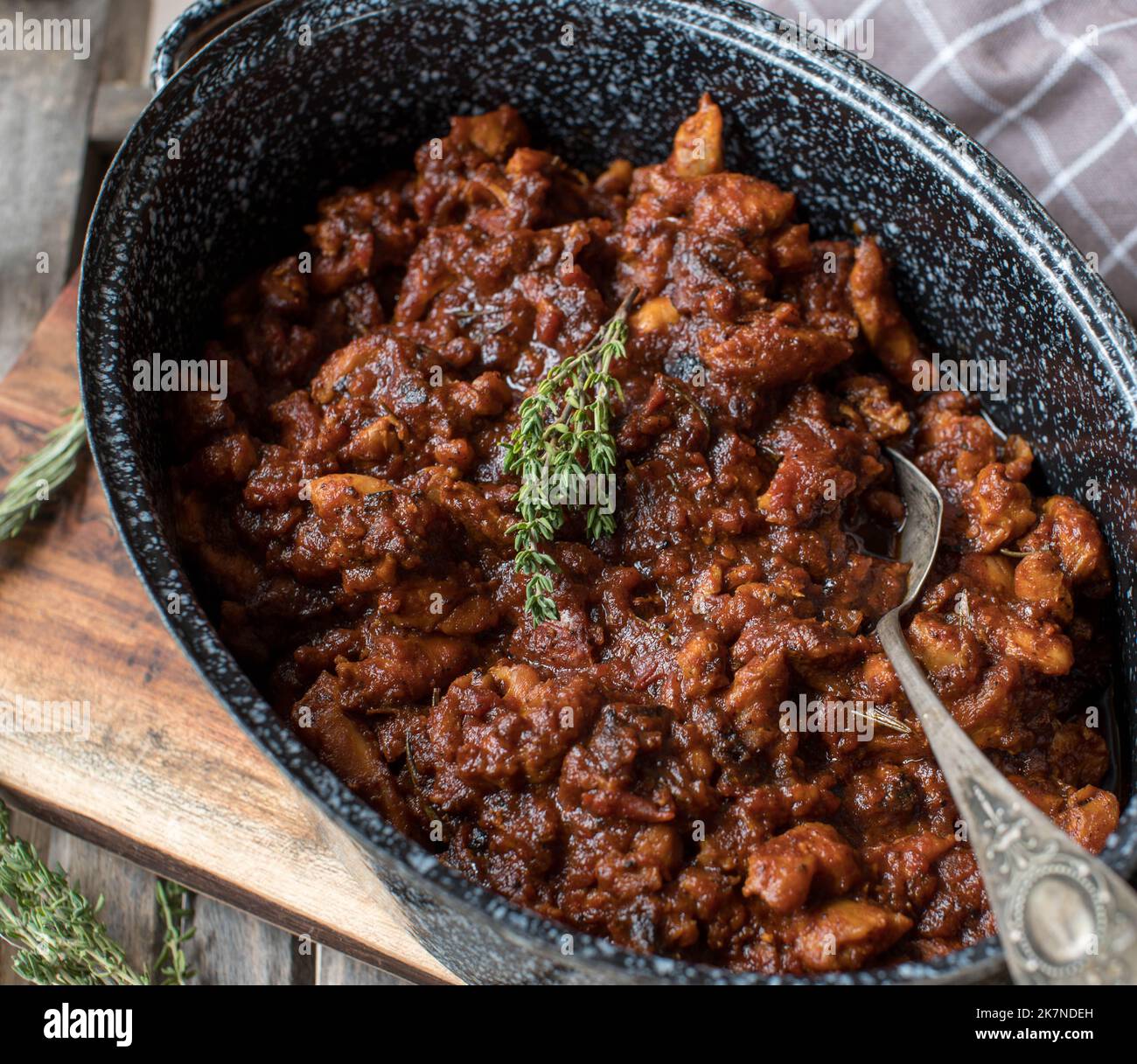 Italian ragout with chicken meat, tomatoes, garlic, herbs and red wine ...