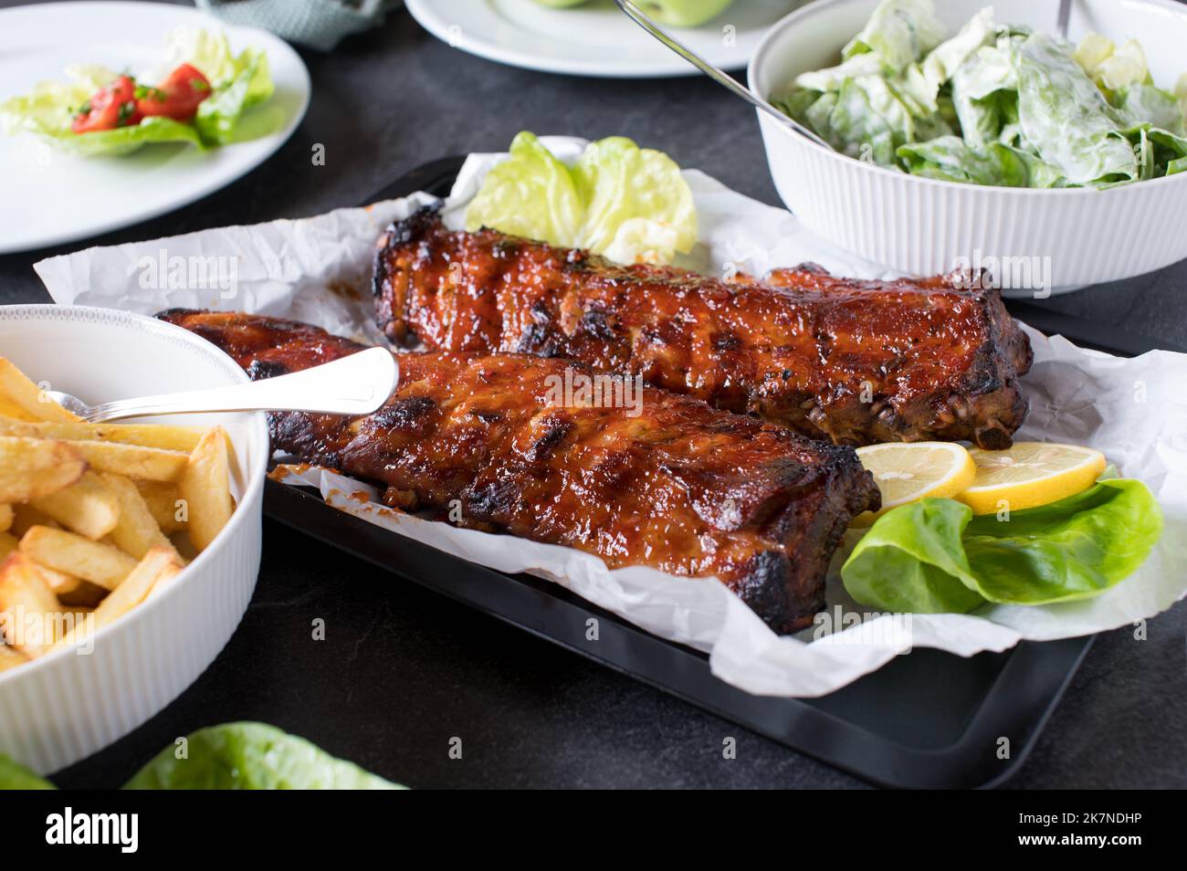 Pork ribs on a dinner table Stock Photo - Alamy