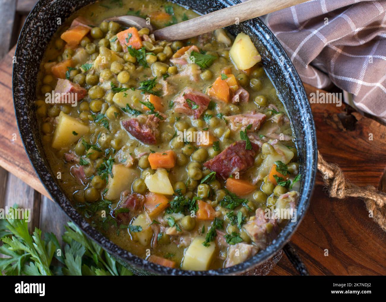 Pea stew with pork meat in a rustic pot. Traditional german cuisine ...